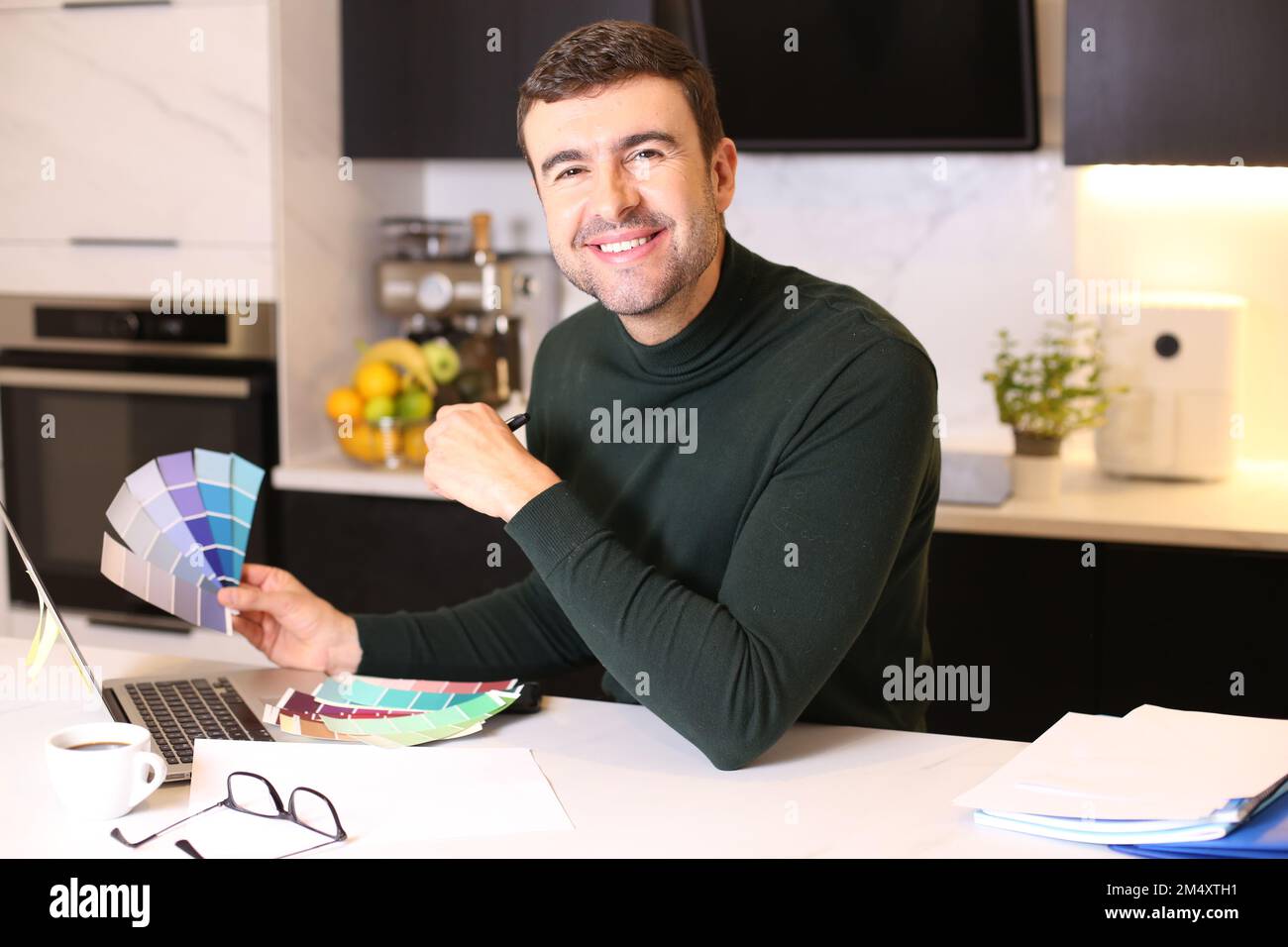 Graphic designer picking the right color for a project Stock Photo - Alamy