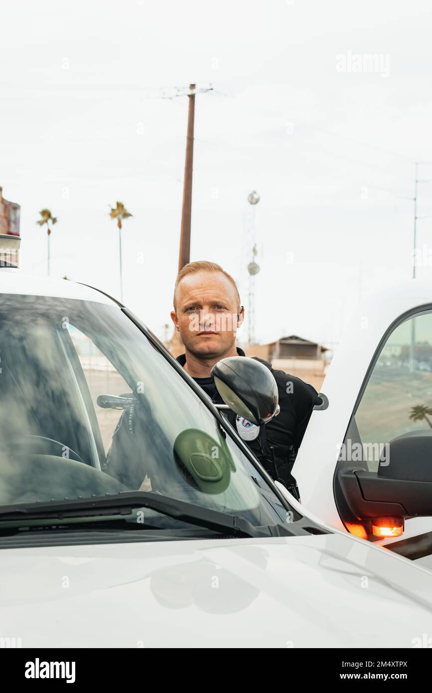 Standing looking at camera arrest police officer hi-res stock ...