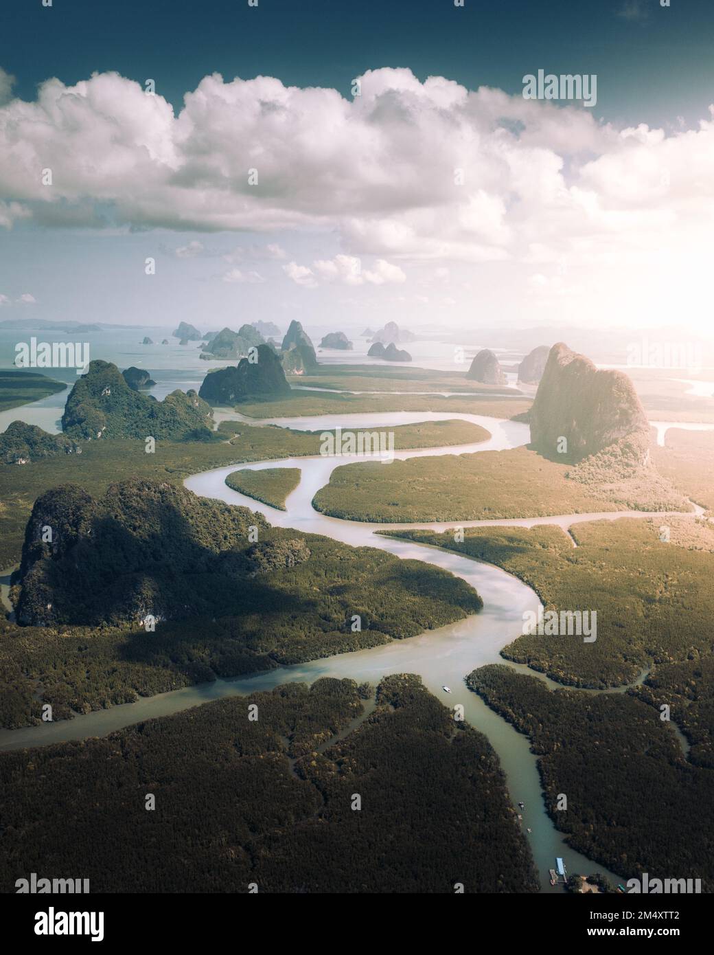 A vertical aerial view of a landscape with river and tall limestone ...