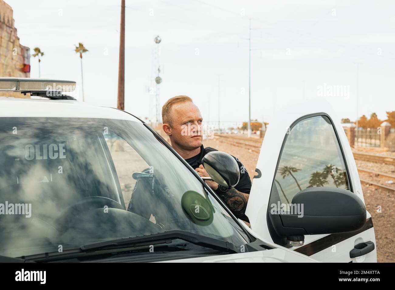 Horizontal image of white male caucasian police officer standing in the ...