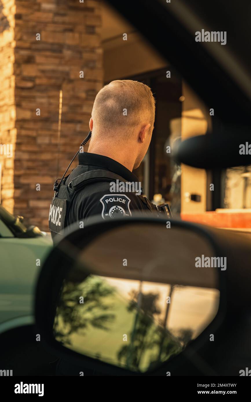 Vertical image of white male caucasian police officer standing outside ...