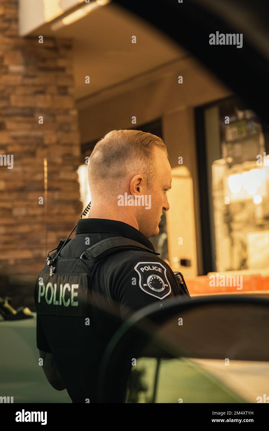 Walking looking away police officer uniform authority hi-res stock ...