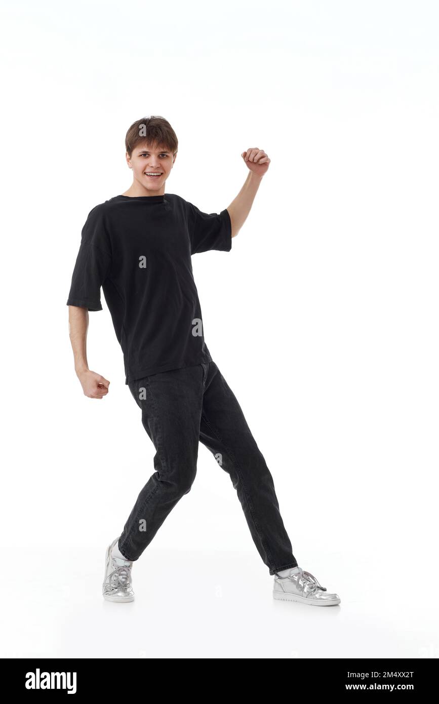 young man in black t-shirt and jeans dancing Stock Photo - Alamy