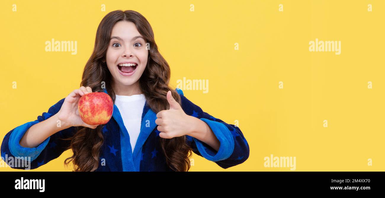best for you. toothy kid showing thumb up. smiling child in pajama ...