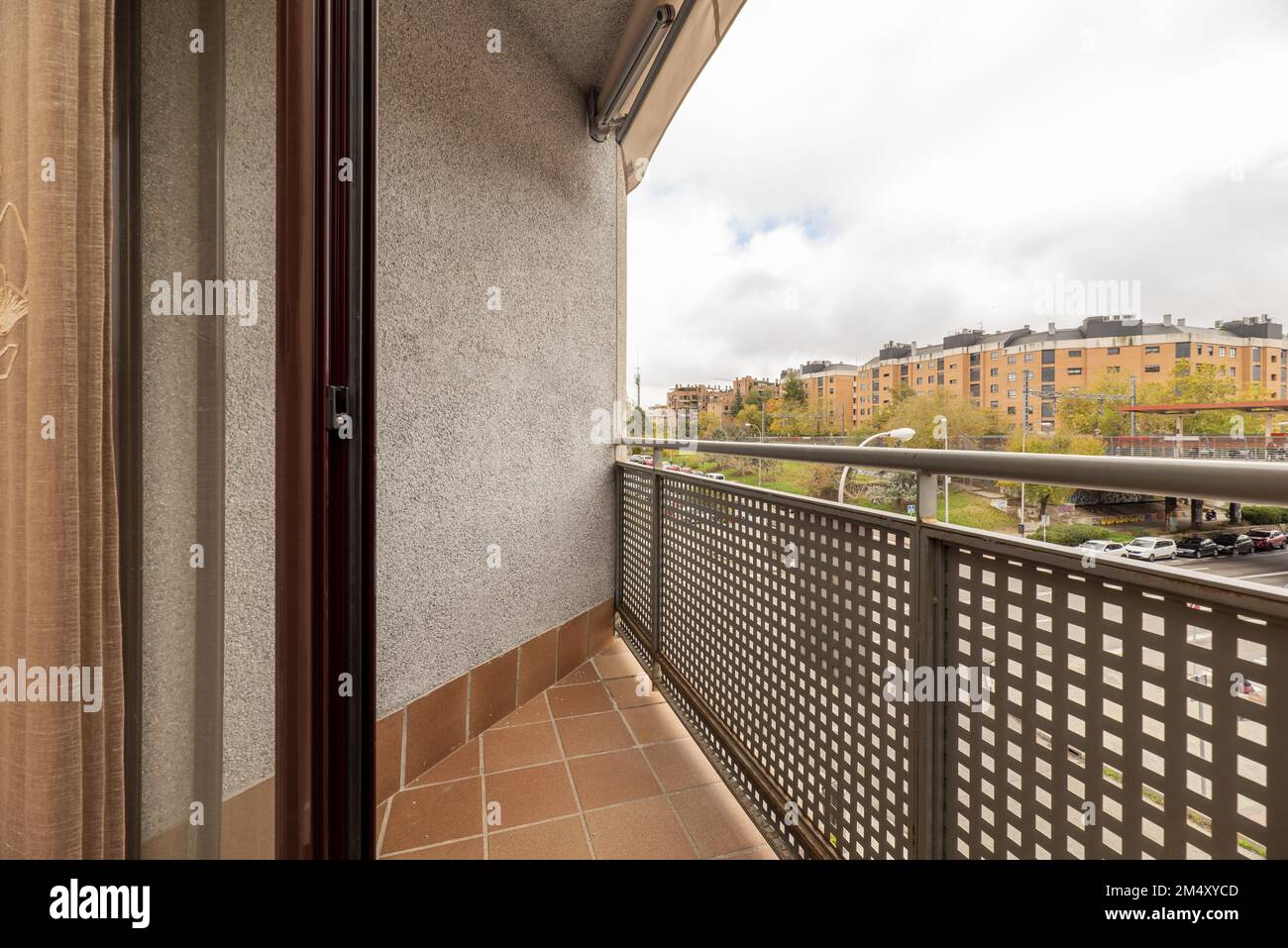 Small triangular terrace with metal railing and views of the park and ...