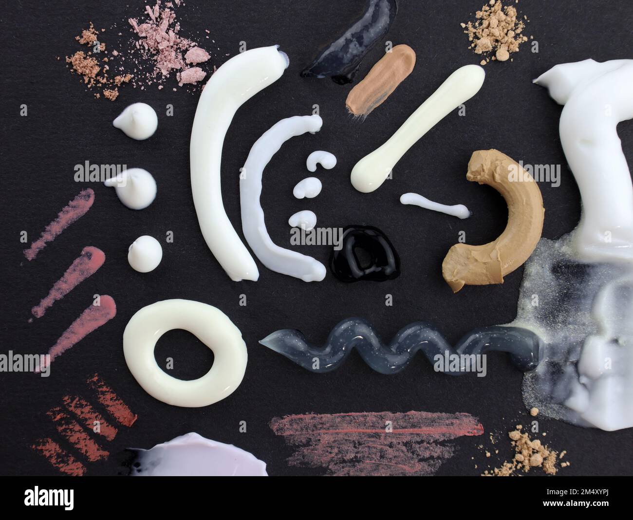 Creams of different colors and textures. Smears of cosmetics ...