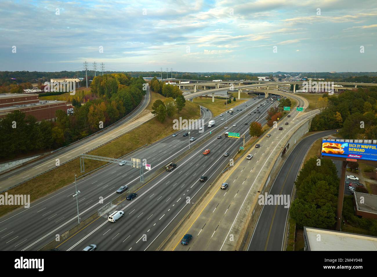 Aerial view of american freeway intersection with fast moving cars and ...