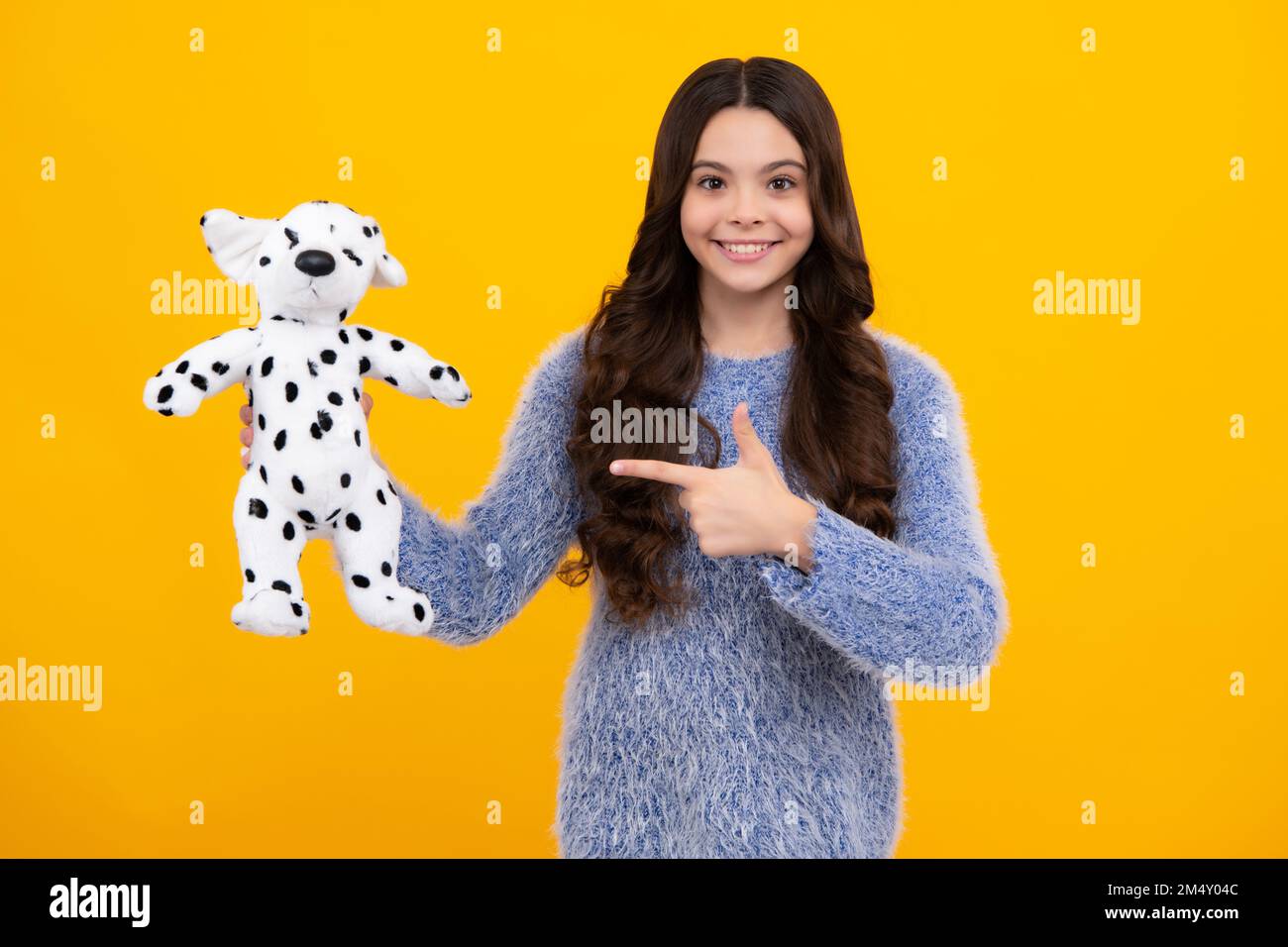 Childhood, toys and kids. Cute teen girl cuddling fluffy toy. Happy ...