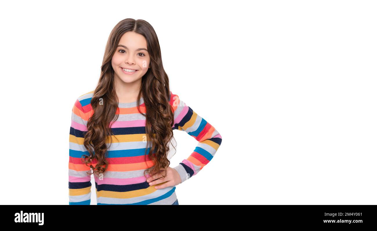 Happy school-aged female child smile in striped sweater isolated on ...