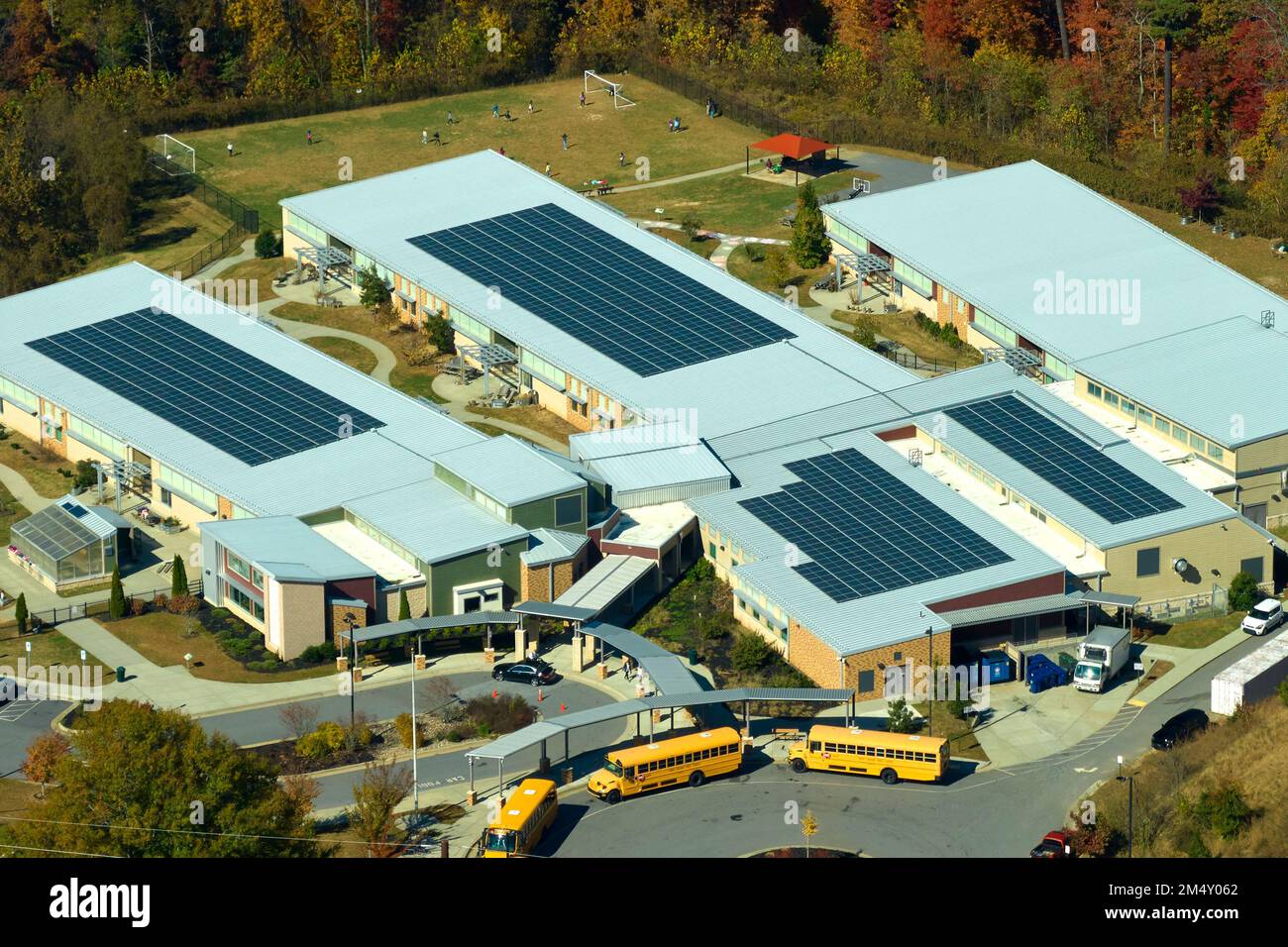 Aerial view of american school building with rooftop covered with ...