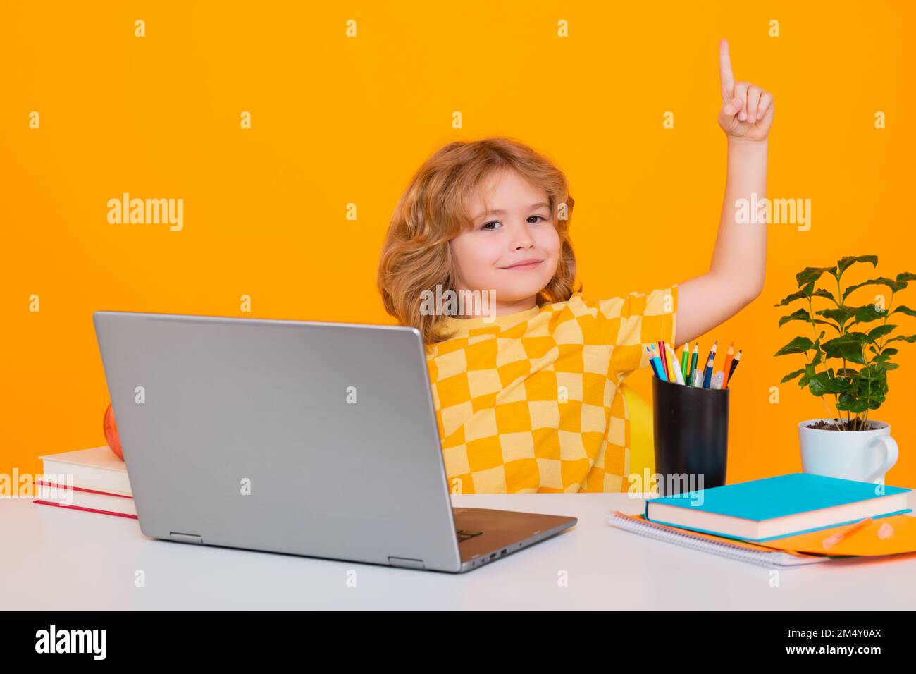 School kid holding index finger up with great new idea. Nerd pupil boy ...