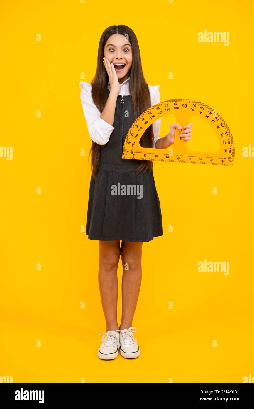 Measuring school equipment. Schoolgirl holding measure for geometry ...