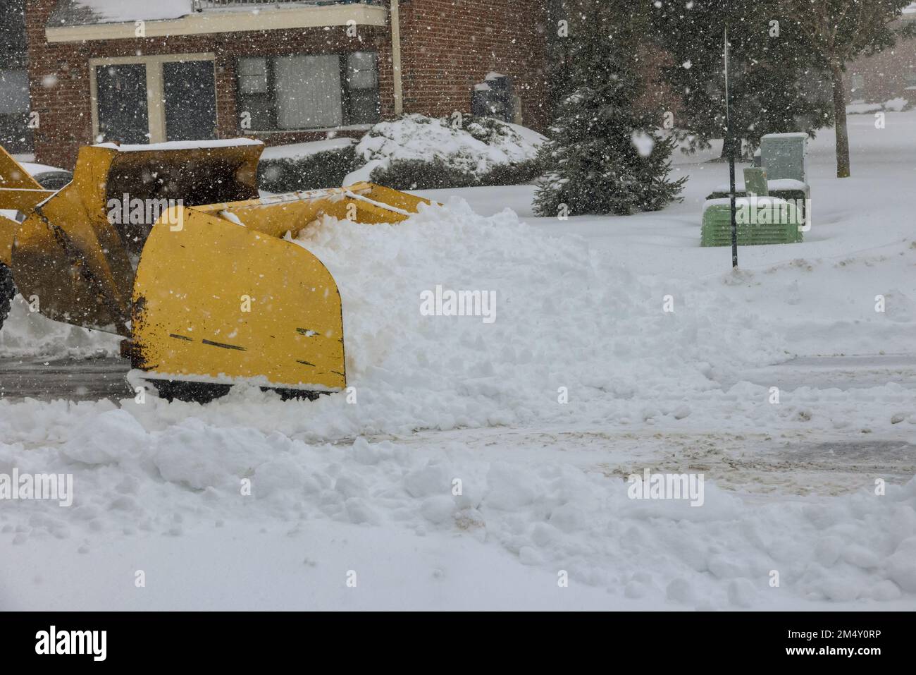 Snow blizzard clean up of snow with tractor during huge snowstorm in ...