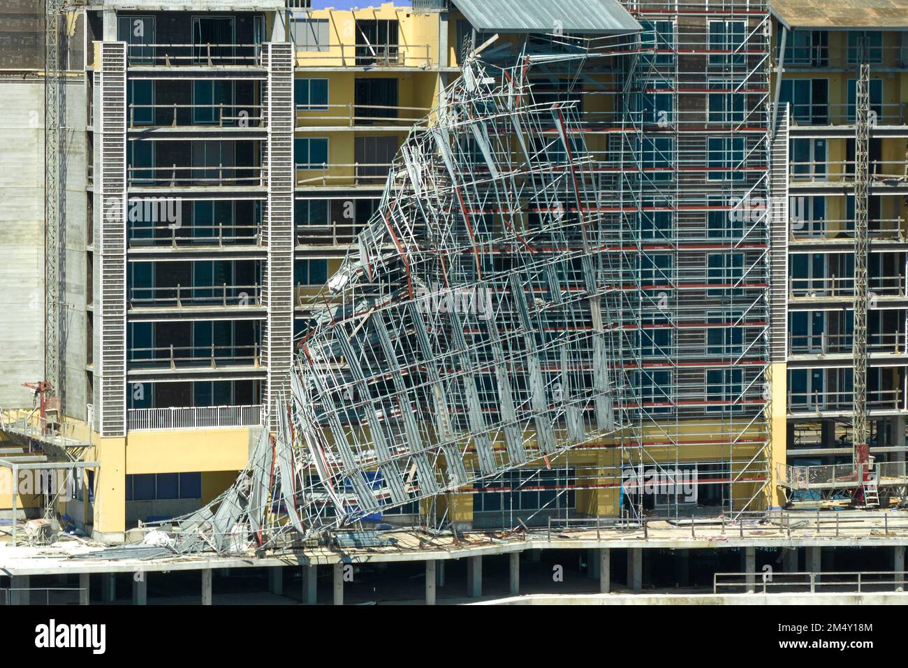 Aerial view of ruined by hurricane Ian construction scaffolding on high ...