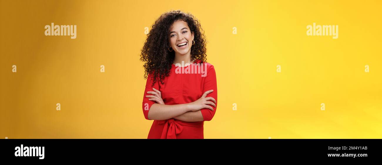 Self-assured happy enthusiastic curly-haired female reporter in cute ...