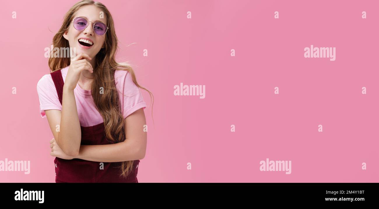 Self-confident good-looking pretty young lady with wavy hair floating ...