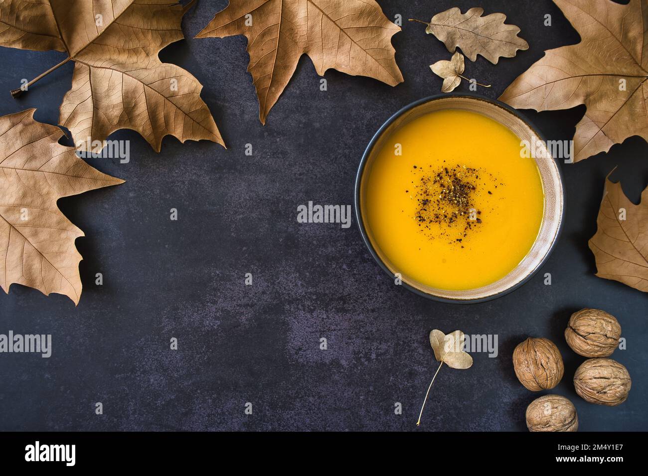Autumnal composition with dried leaves and delicious creamy homemade ...