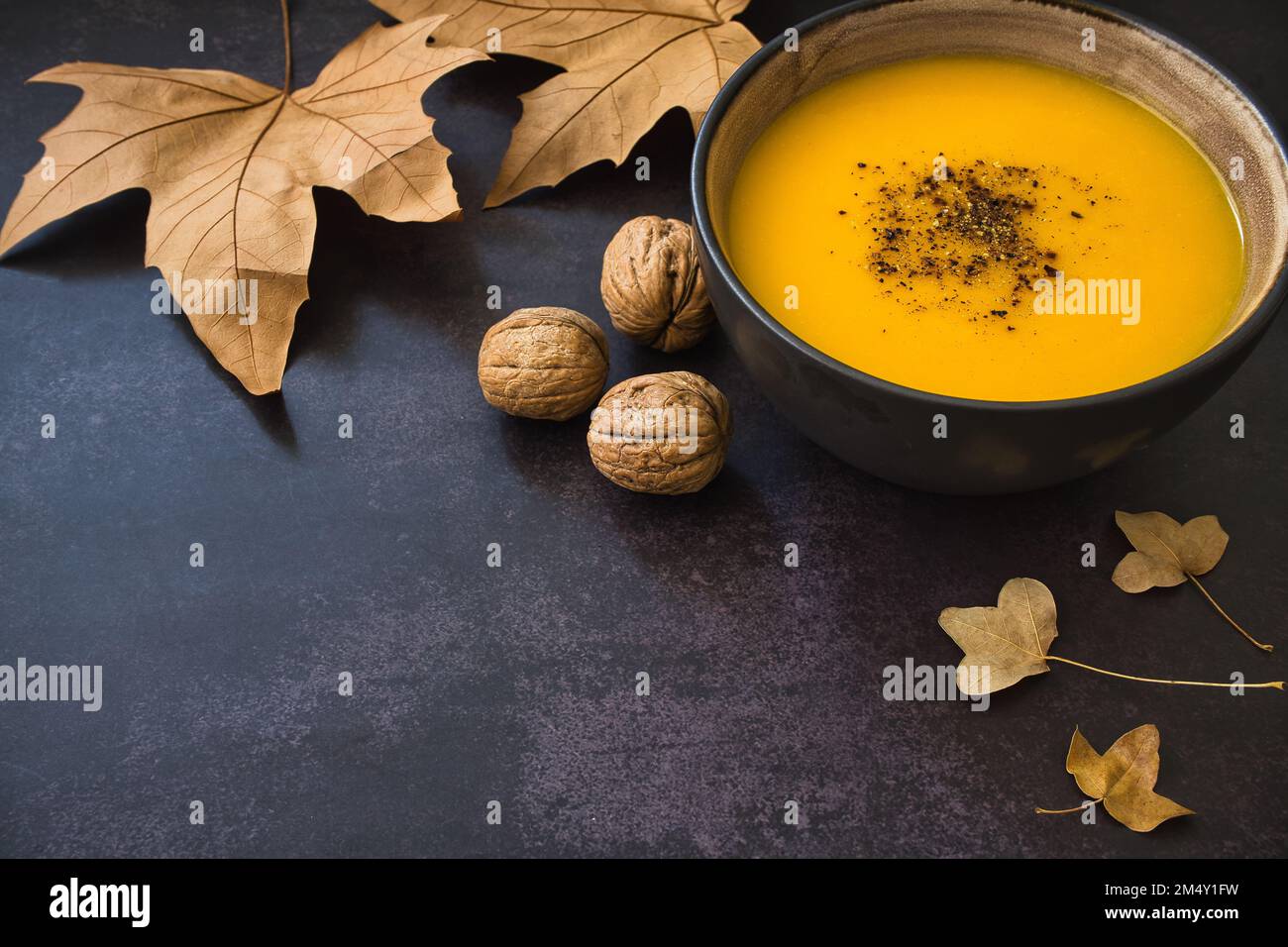 Autumnal composition with dried leaves and delicious creamy homemade ...
