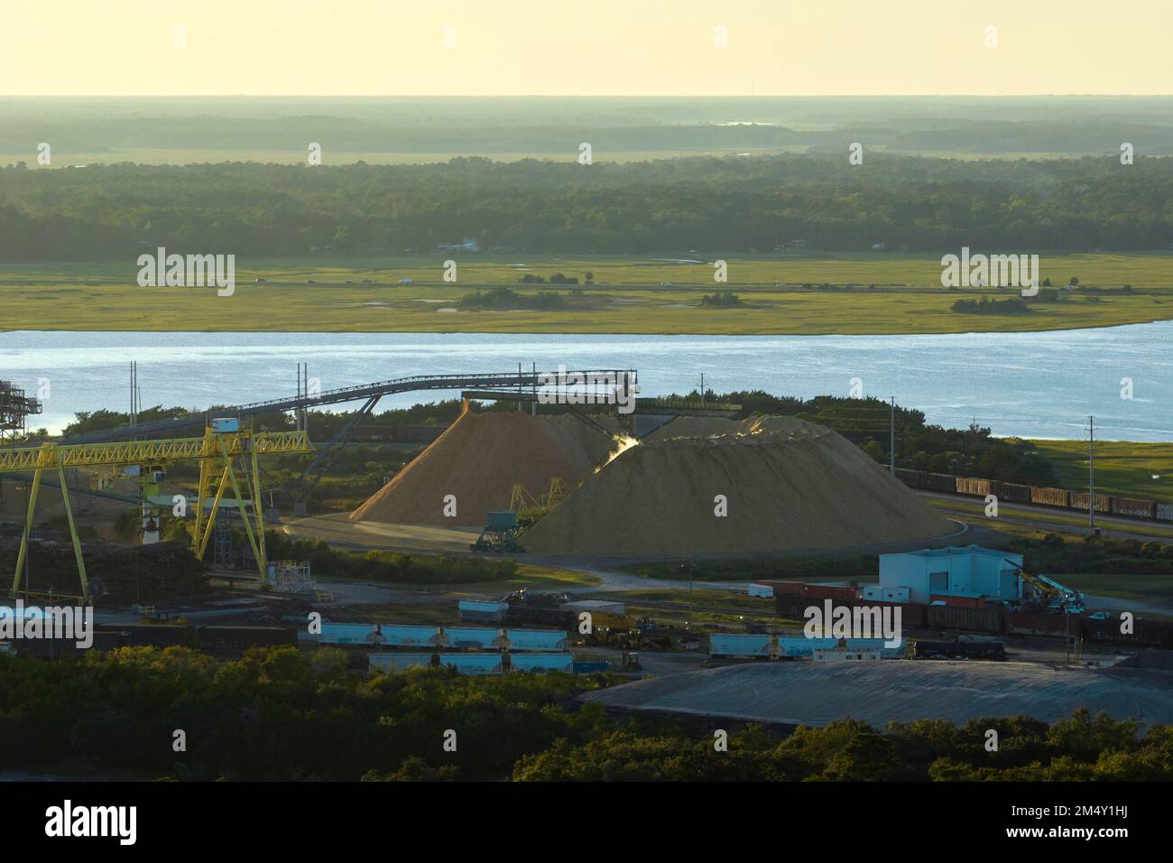 Aerial view of wood processing factory with smoke from production ...