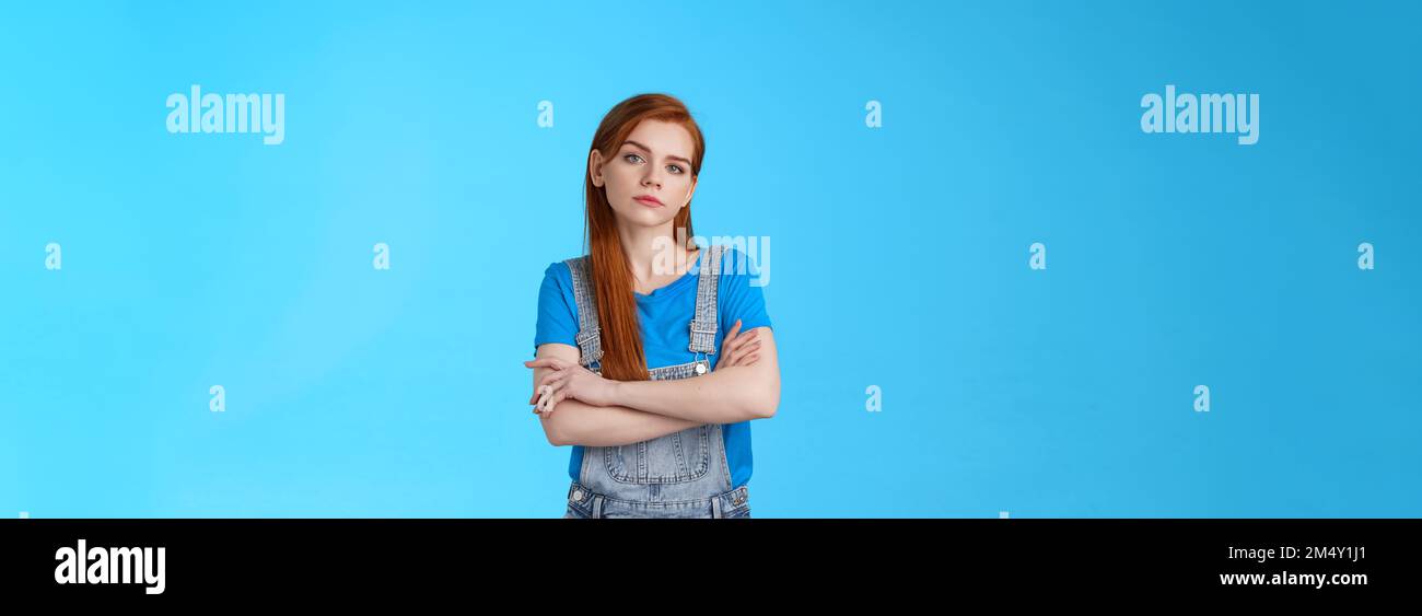 Serious-looking professional bossy redhead female skilfull girl, cross ...