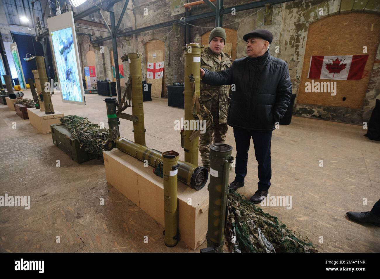 Lviv, Ukraine 23 December 2022. Ukrainian serviceman shows a civilian ...