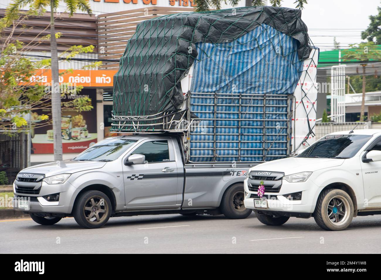 RATCHABURI, THAILAND, NOV 16 2022, A fully loaded pick up is driving ...