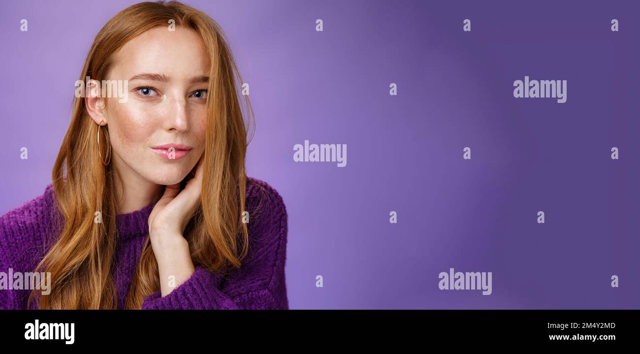 Sensual and romantic woman with red hair and freckles touching cheek ...