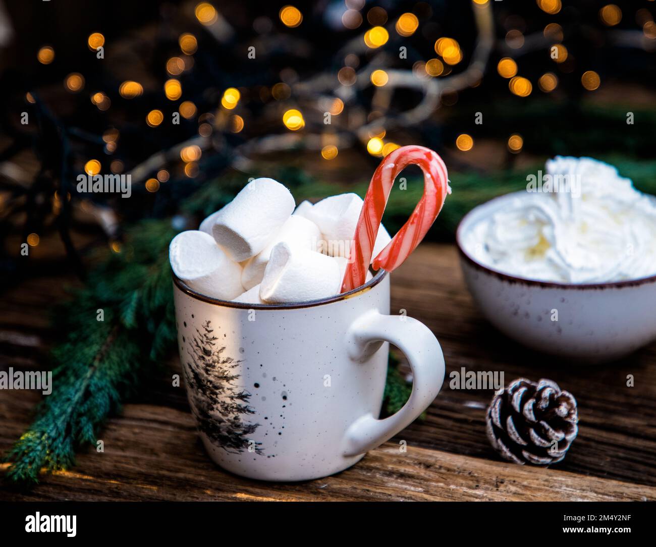 hot Christmas drink with marshmallow on wooden table Stock Photo - Alamy