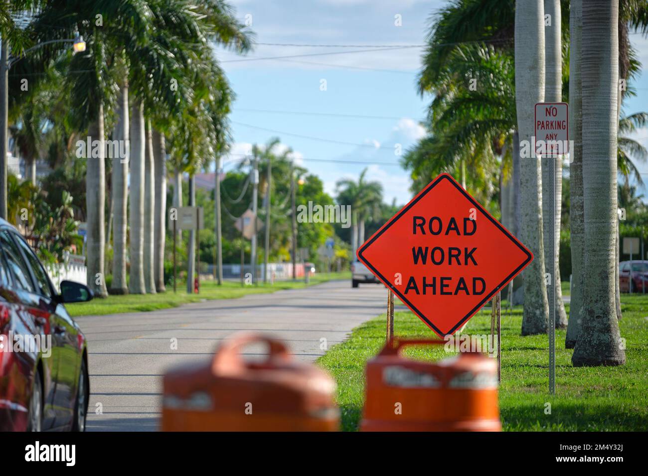 Road work ahead sign on street site as warning to cars about ...