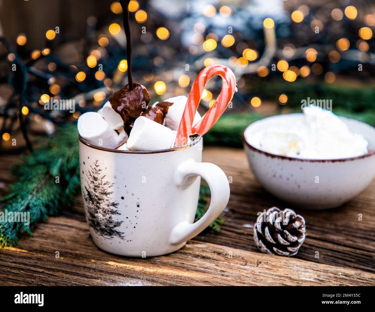 hot Christmas drink with marshmallow on wooden table Stock Photo - Alamy