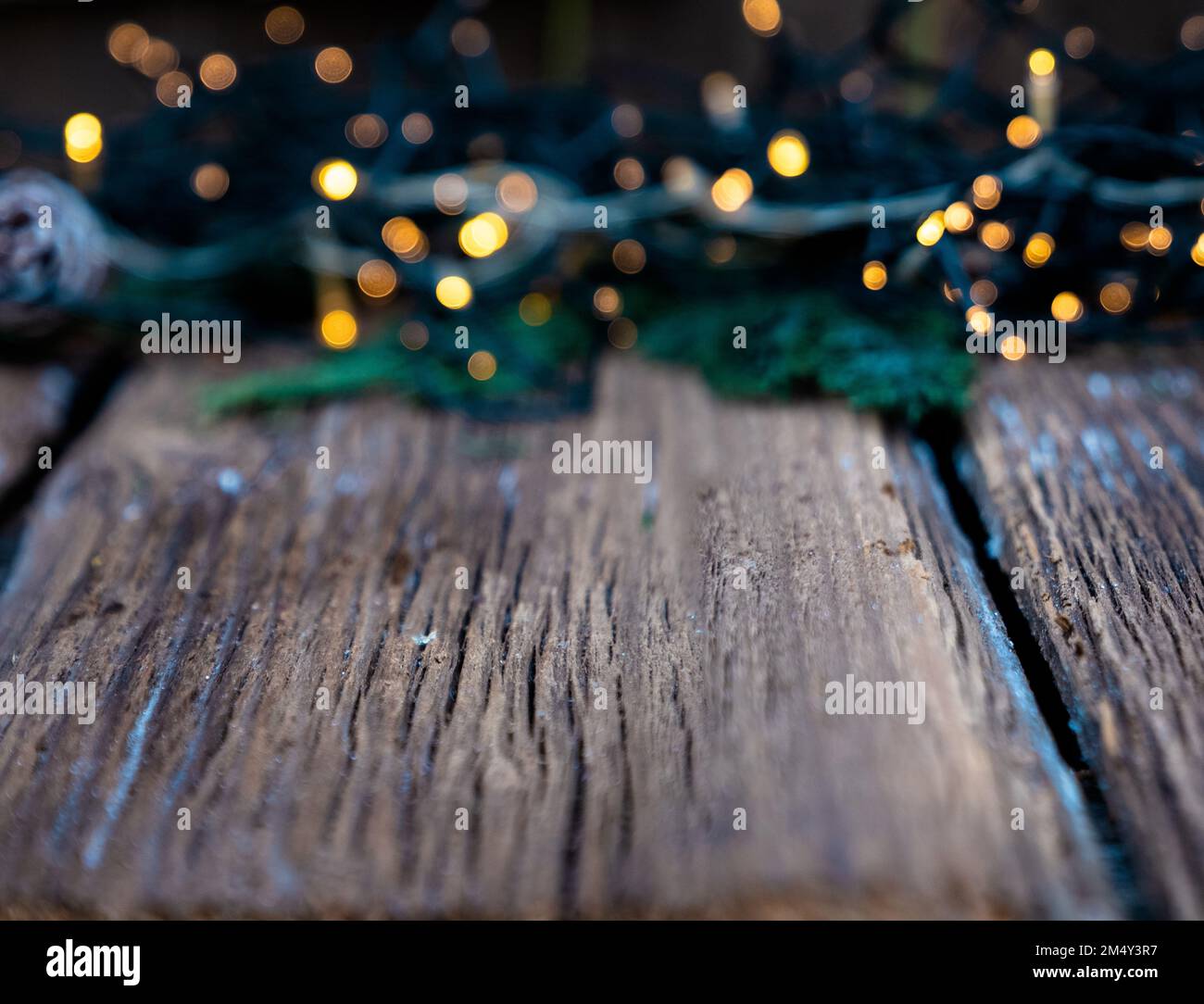 empty wooden table and Christmas lights Stock Photo - Alamy