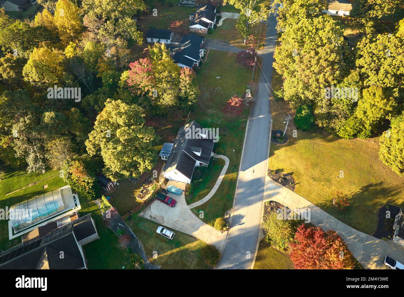 View from above of expensive residential houses between yellow fall ...