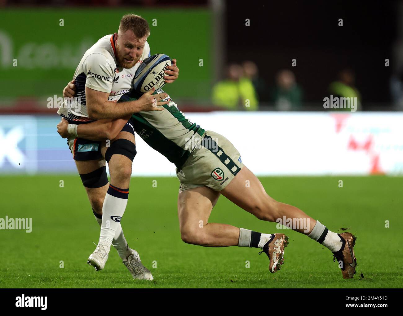 Saracens' Jackson Wray (left) tackled by London Irish's Oliver Hassell ...