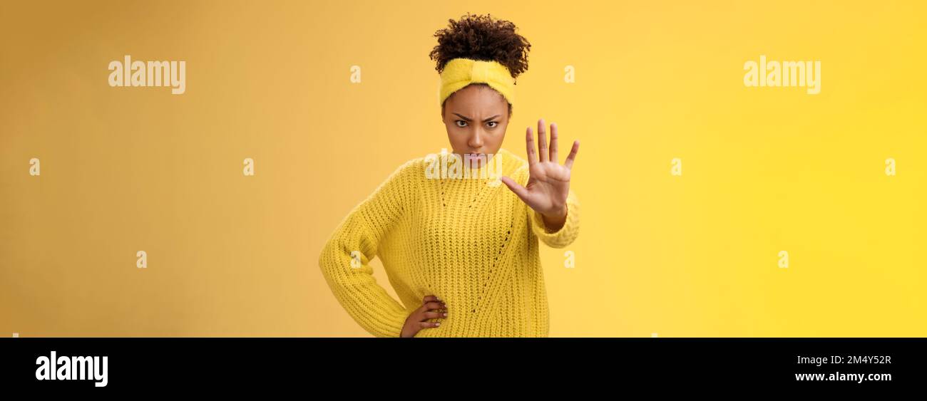 Brave serious-looking female african american femenist look from under ...