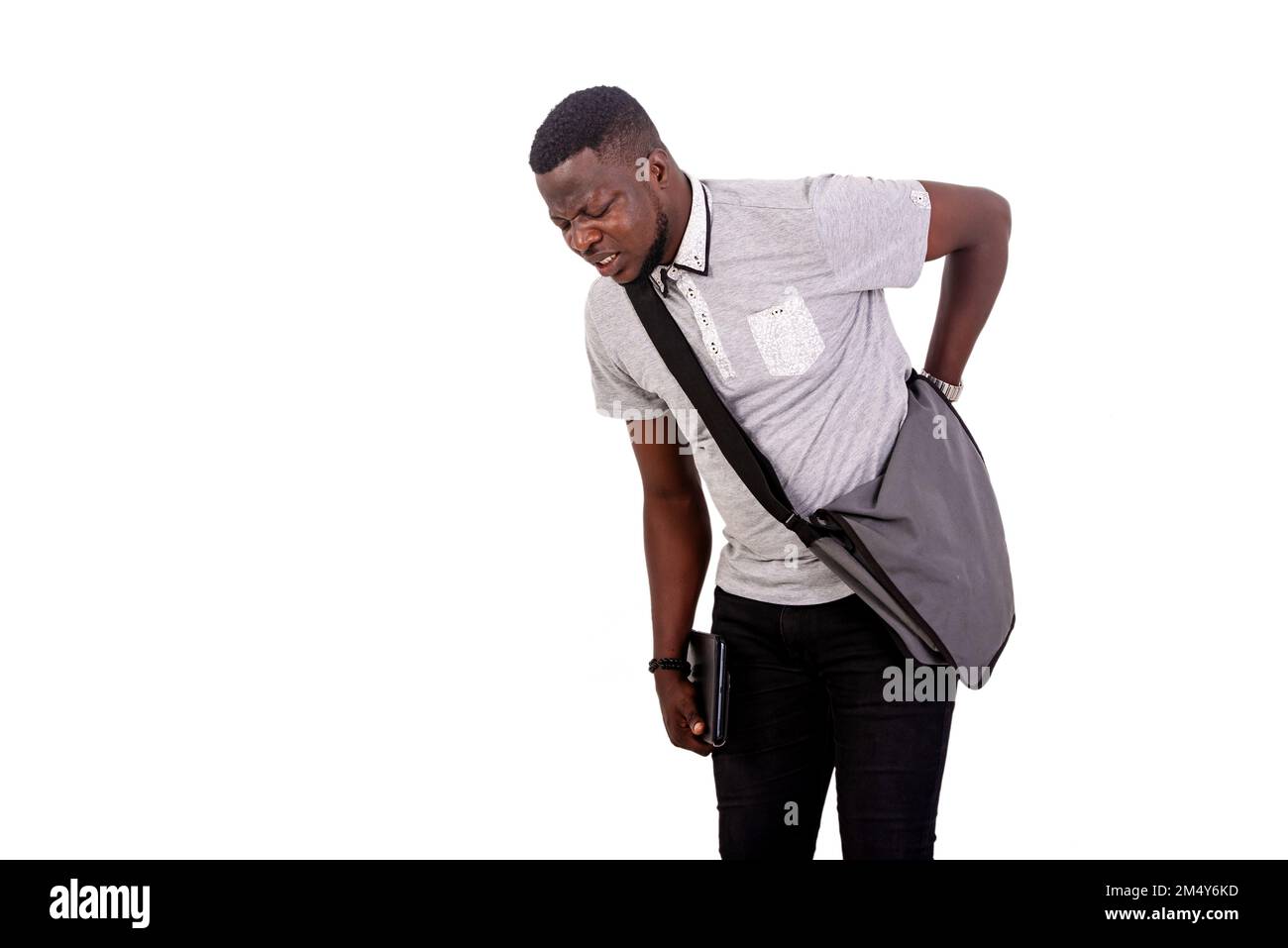 young man student with tired shoulder bag feeling back pain Stock Photo ...
