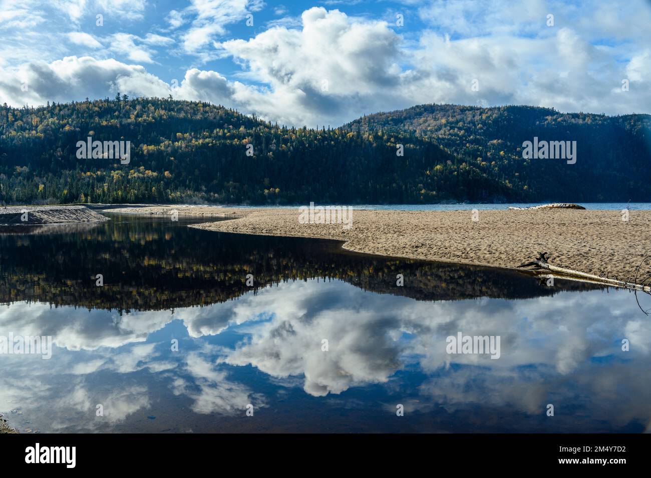Autumn sky reflections in the Old Woman River, Lake Superior Provincial ...