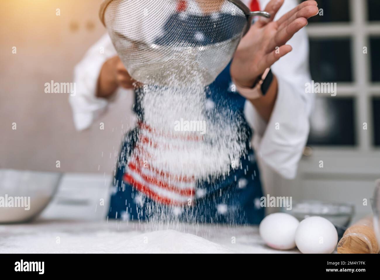 Woman sifting flour through hi-res stock photography and images - Alamy