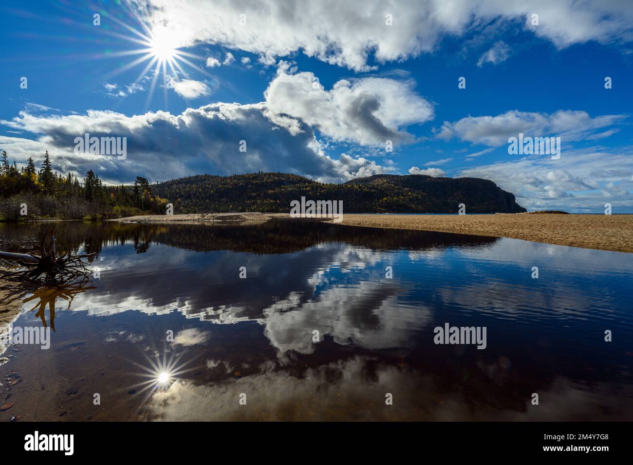 Autumn sky reflections in the Old Woman River, Lake Superior Provincial ...