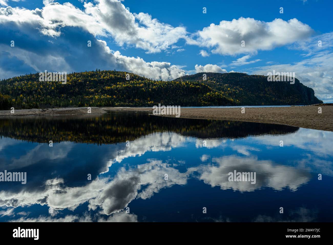 Autumn sky reflections in the Old Woman River, Lake Superior Provincial ...