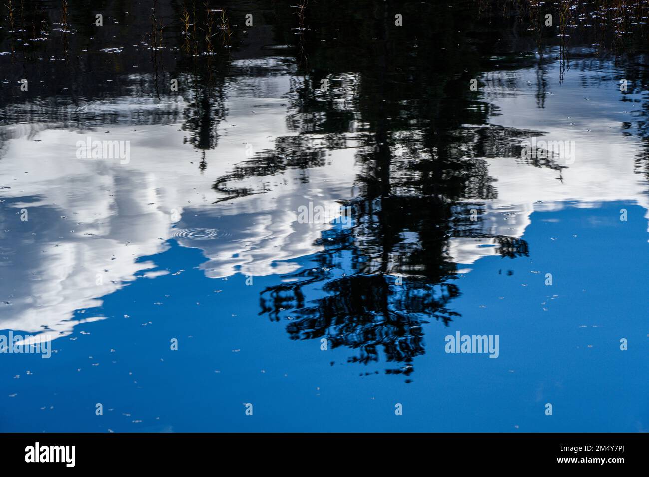 Autumn sky reflections in the Old Woman River, Lake Superior Provincial ...