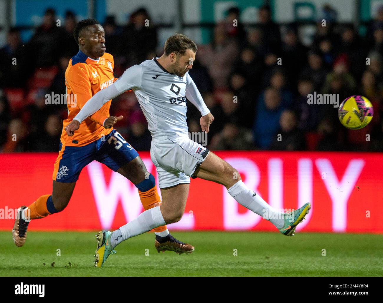 Ross County's Connor Randall blocks a shot from Rangers' Malik Tillman ...
