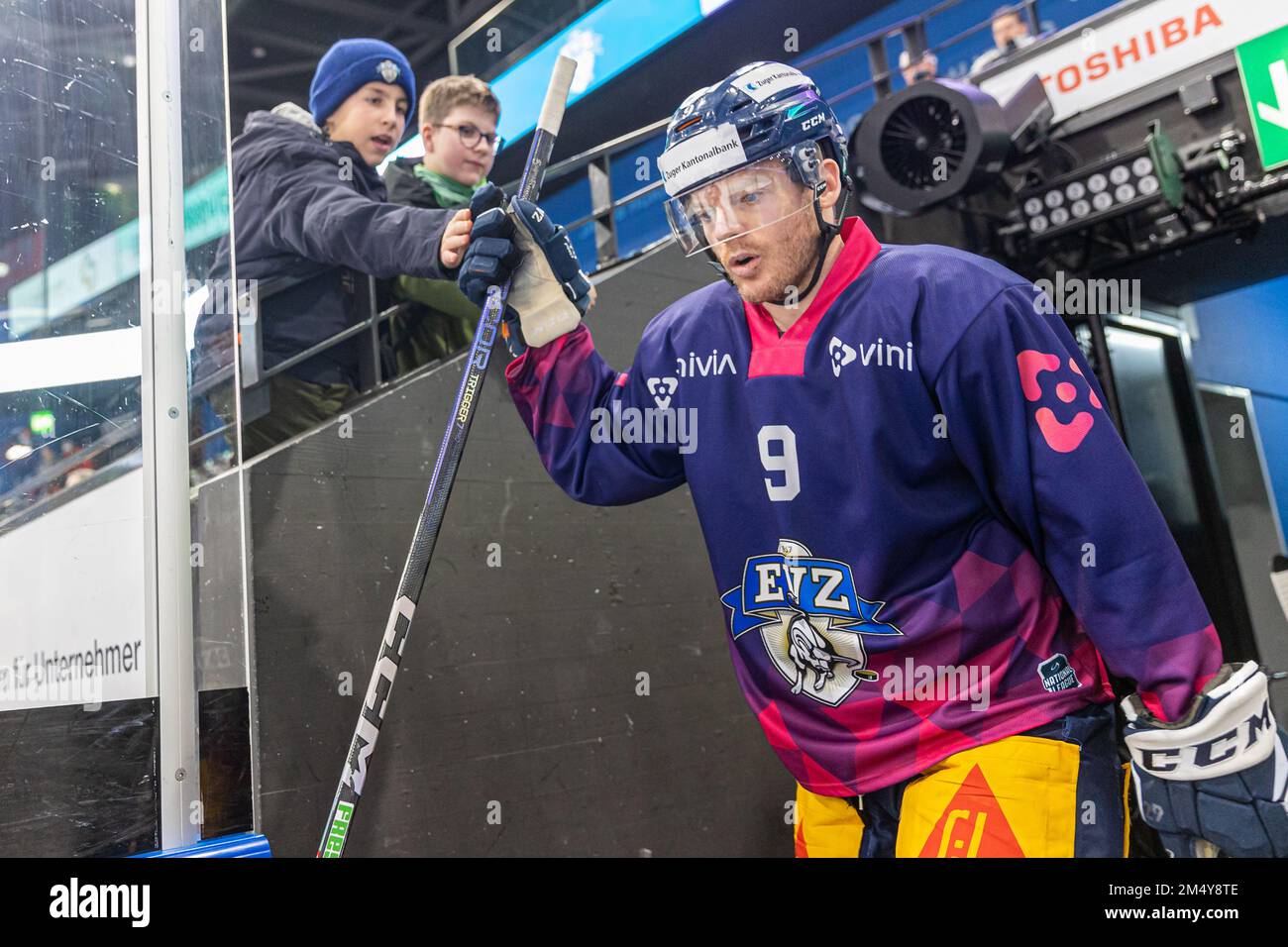 Brian O'Neill #9 (EV Zug) high fives with his fans during the National ...