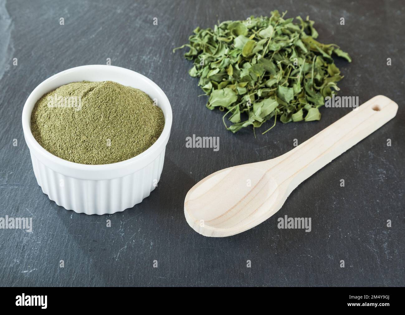 Moringa oleifera medicinal plant - moringa powder and dried leaves ...