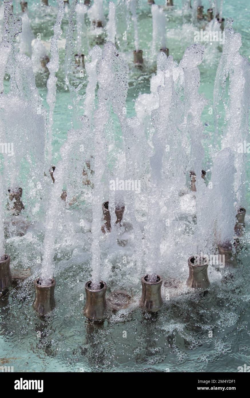 The fountains gushing sparkling water in a pool in a park Stock Photo ...