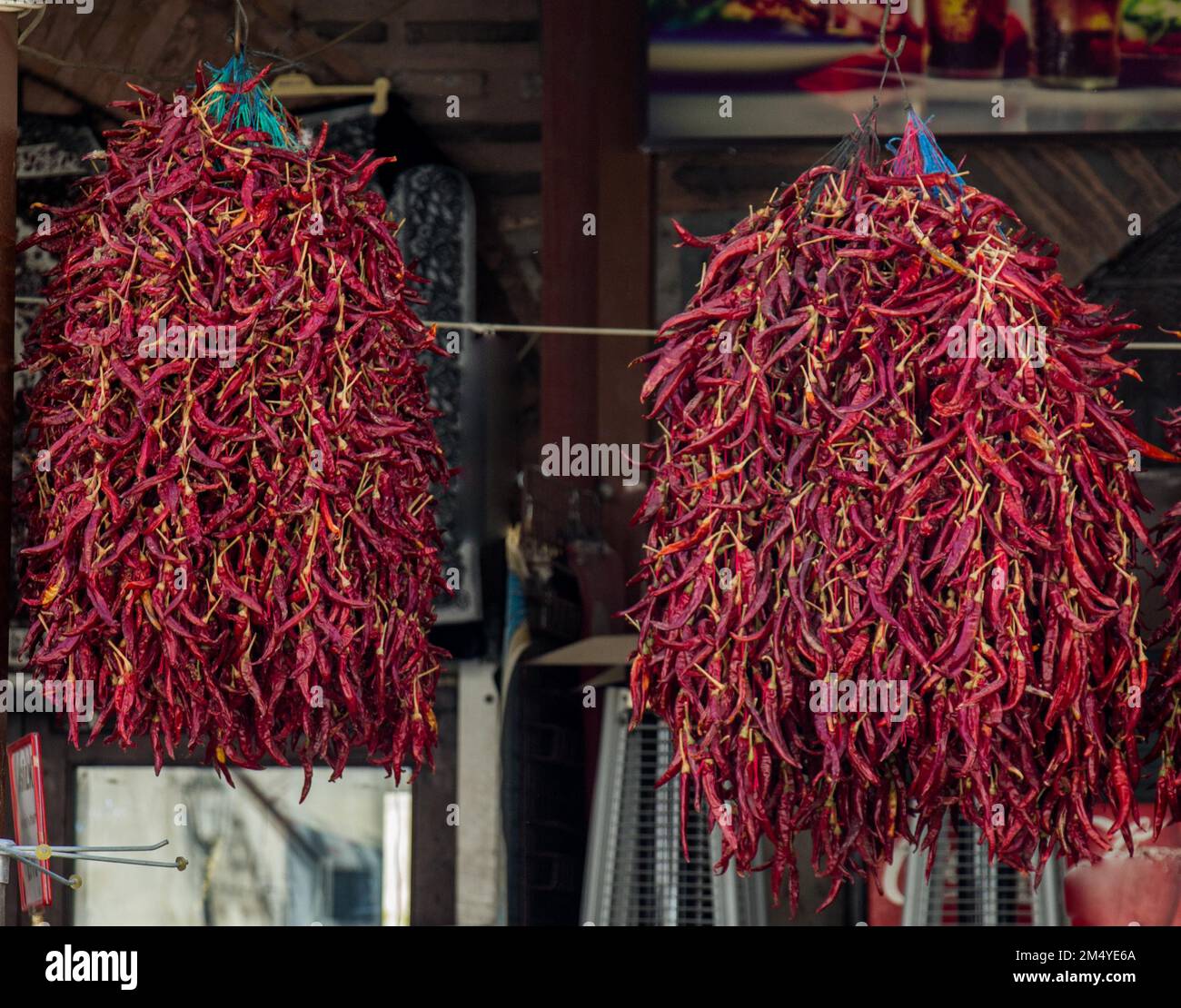Bundles of red peppers dry in the sun Stock Photo - Alamy