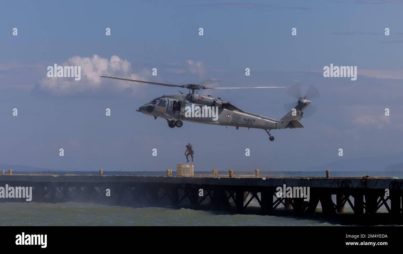 A U.S. Navy MH-60 Sea Hawk with the USNS Comfort conducts a vertical ...