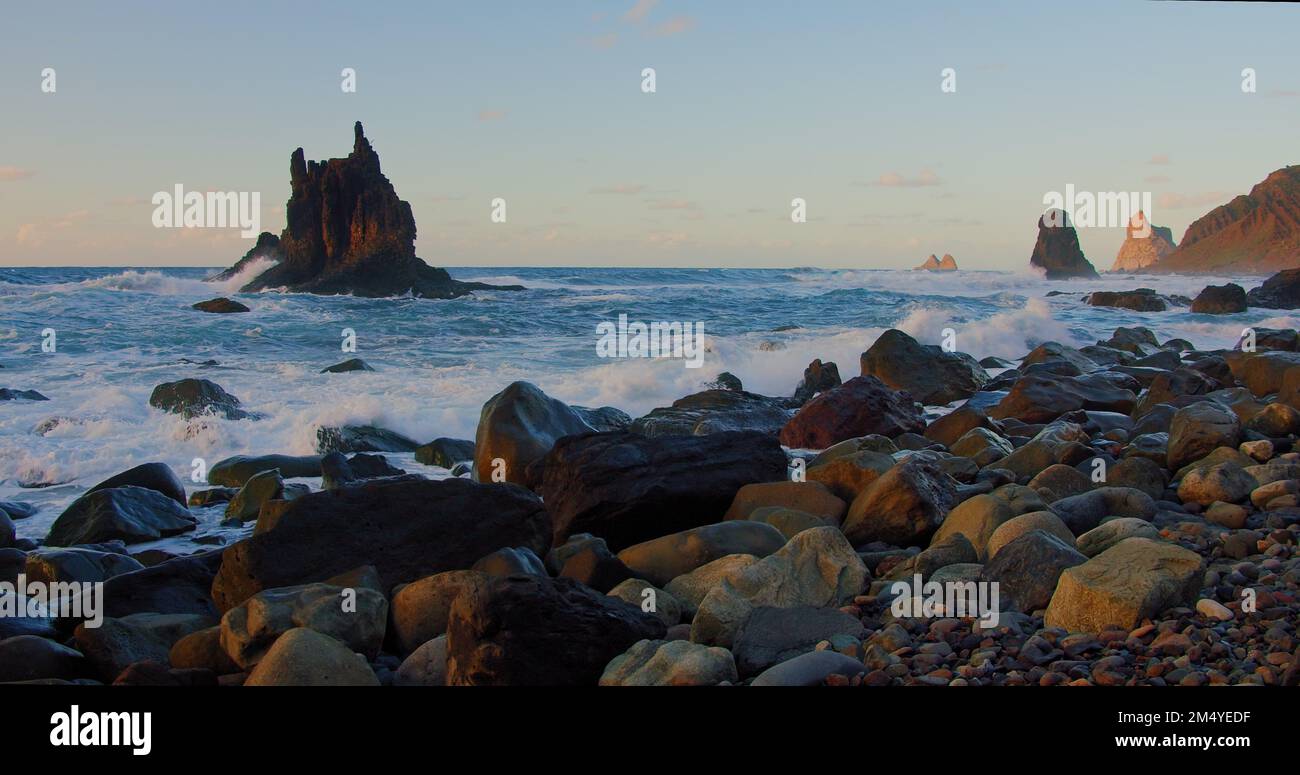 Beautiful natural sea landscape with rocky volcanic beach. Rolling big ...
