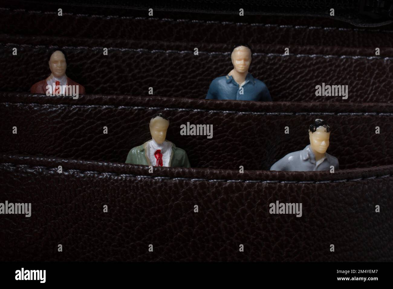Tiny figurine of group of men miniature model in pockets Stock Photo ...