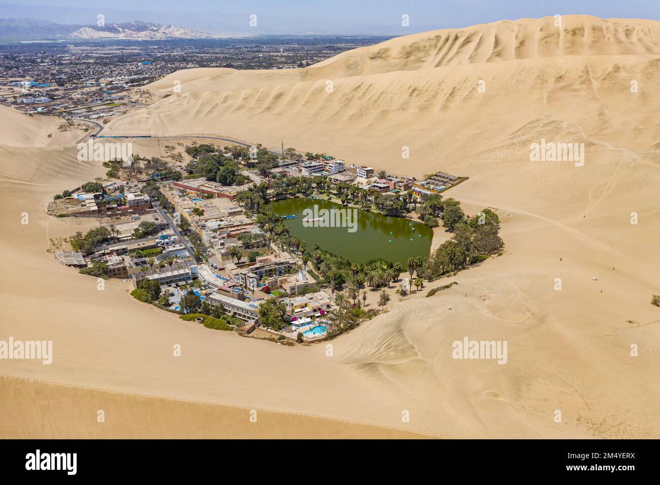 Aerial view of the desert oasis of Huacachina near the city of Ica in ...