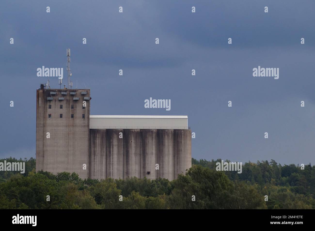 Low angle view of silo building against sky Stock Photo - Alamy